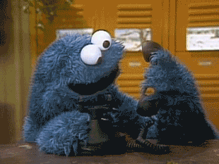 Image - Cookie eats phone Xmas Eve.gif | Muppet Wiki | Fandom powered ...
